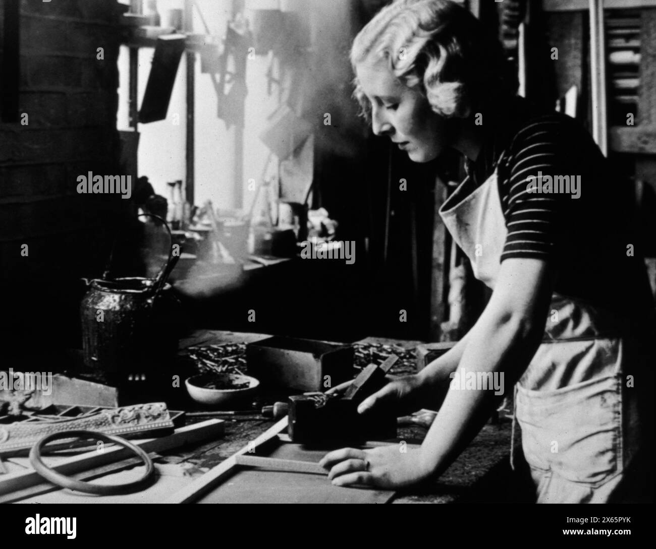 British woman working as a carpenter during WWII, UK 1940s Stock Photo ...