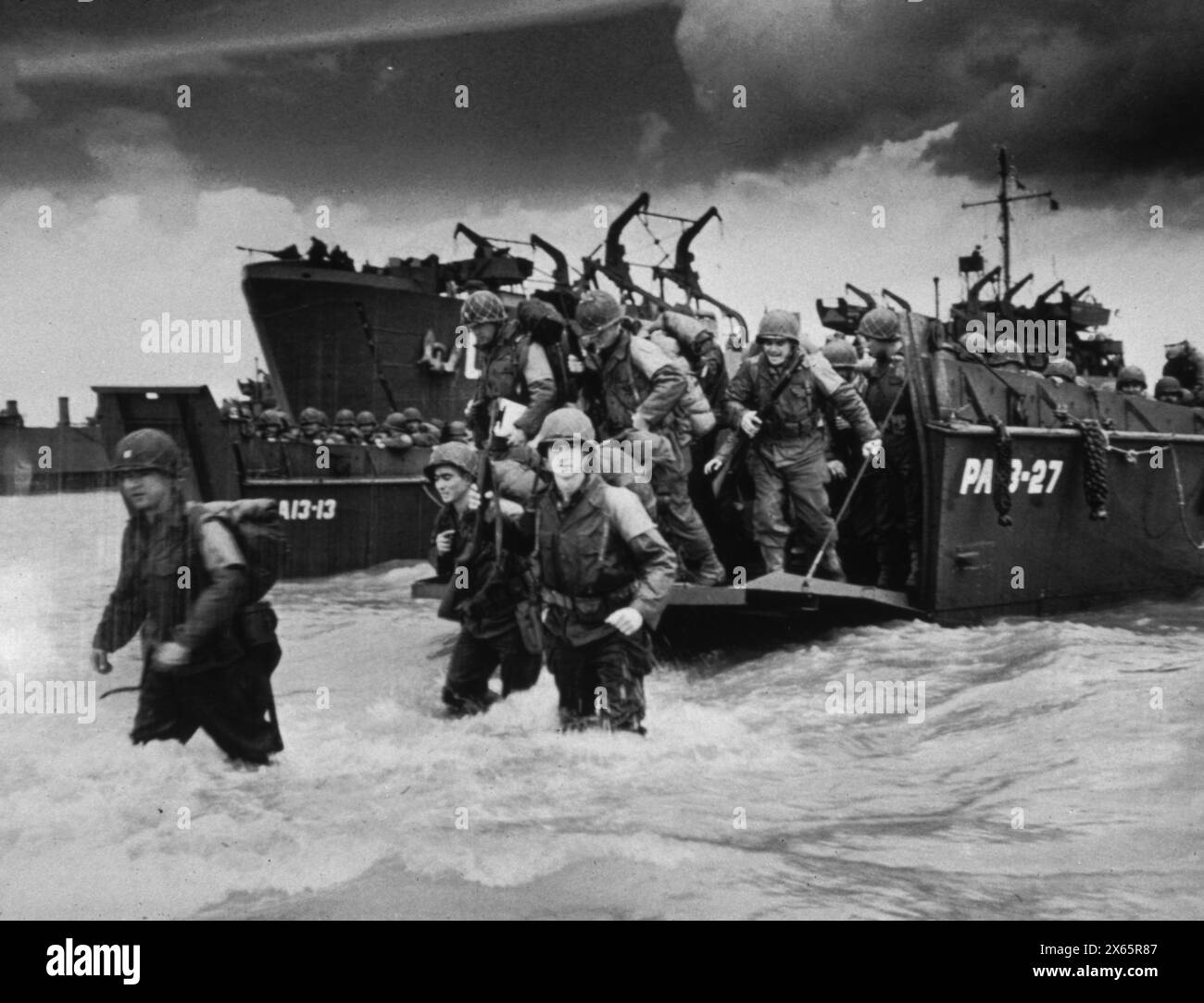 US Marines jumping from the landing craft during the D-Day of WWII ...