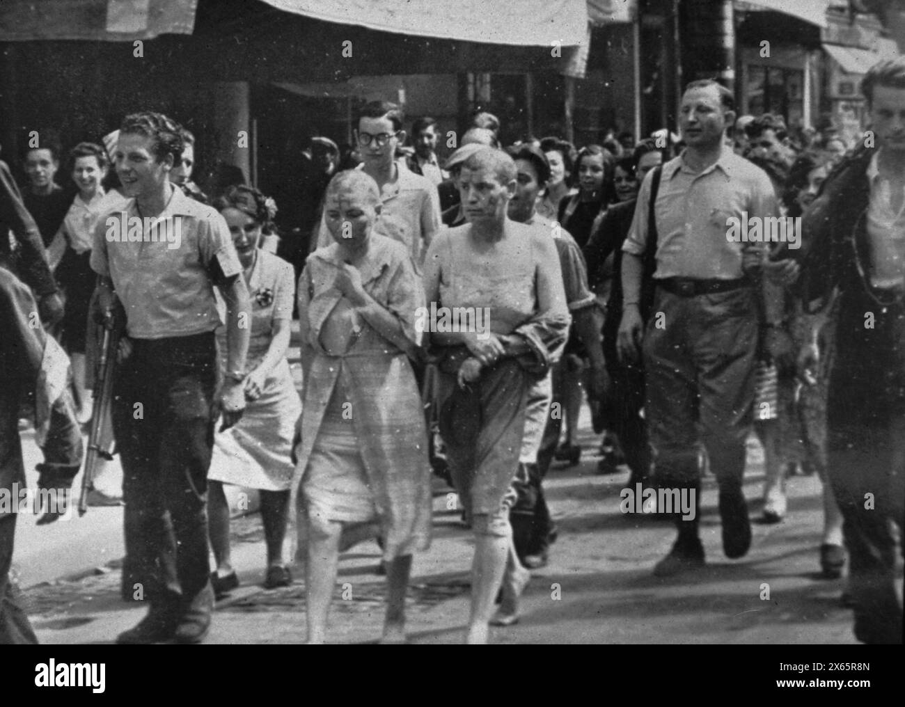 French women collaborators forced to march in the street after the ...