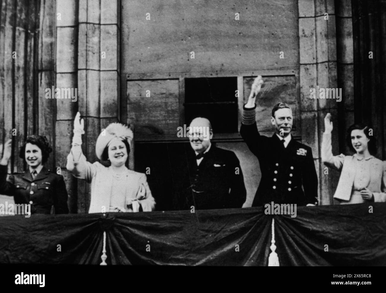The British Royal Family and PM Winston Churchill waving from the ...