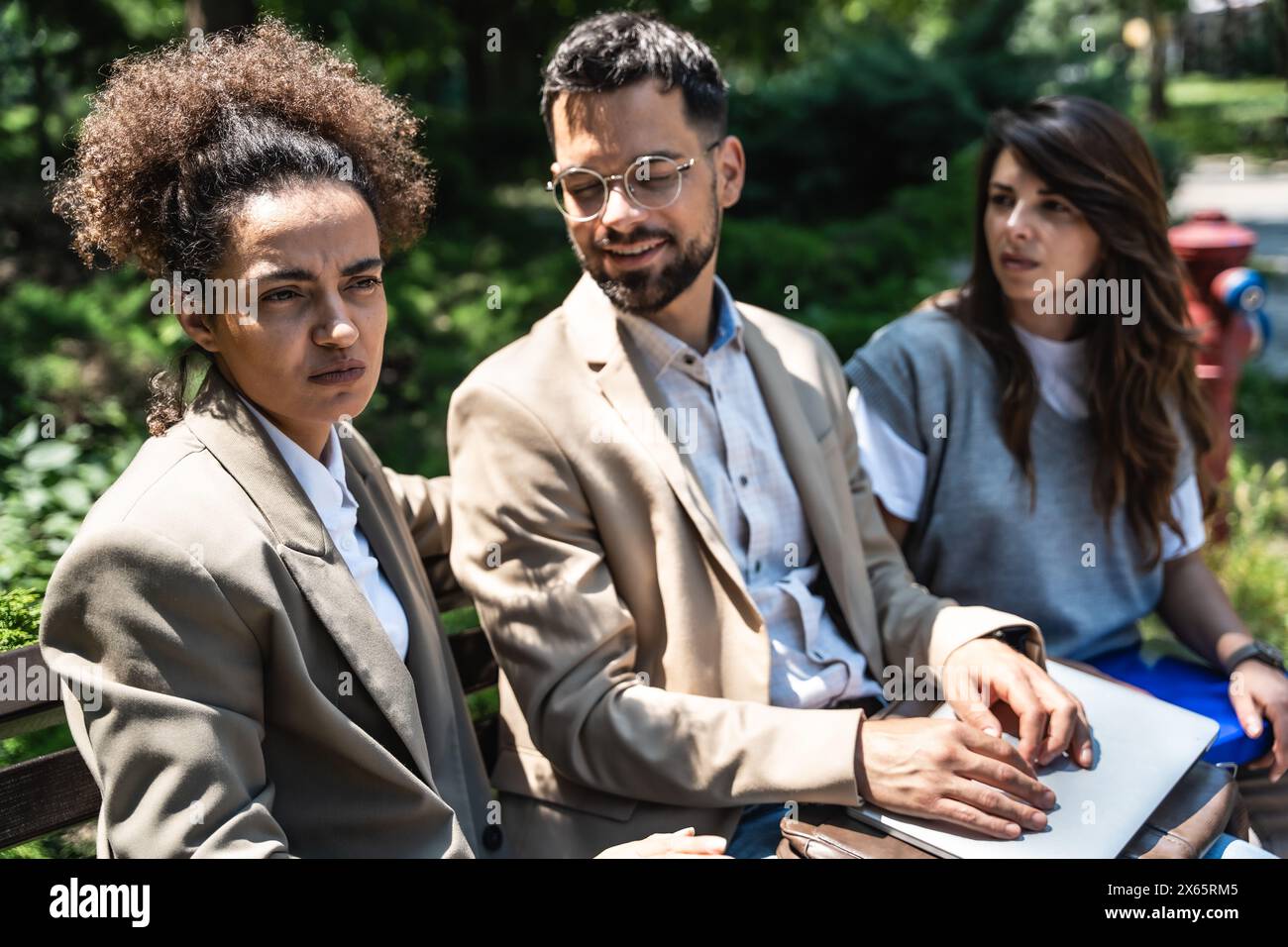 Group of young business people, businessman and two businesswoman ...