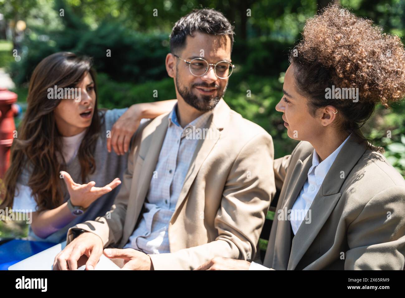 Group of young business people, businessman and two businesswoman ...