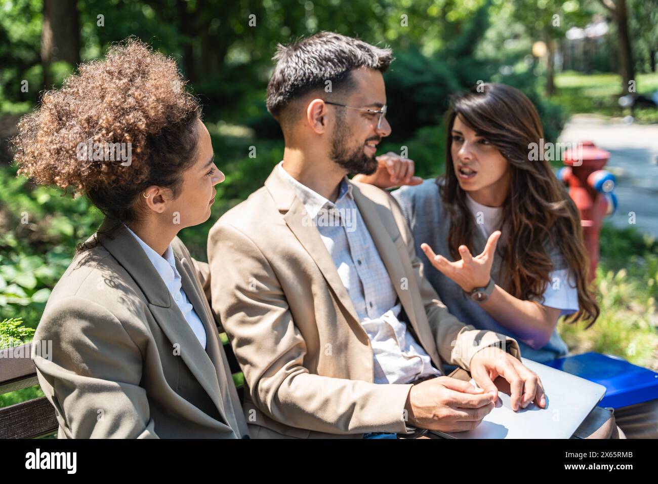 Group of young business people, businessman and two businesswoman ...