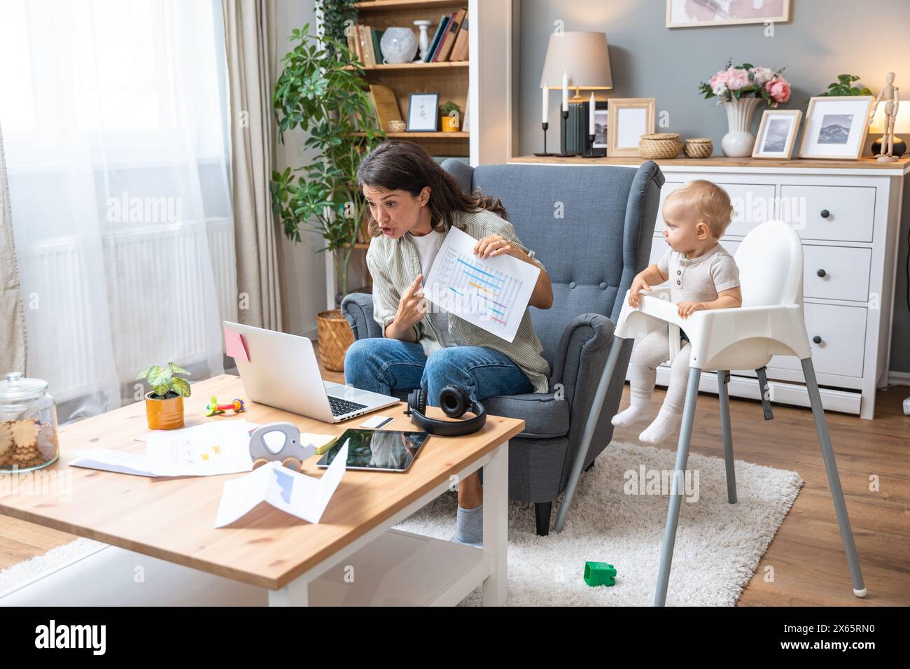 Multitasking mother. Young freelance business mom taking care of her ...