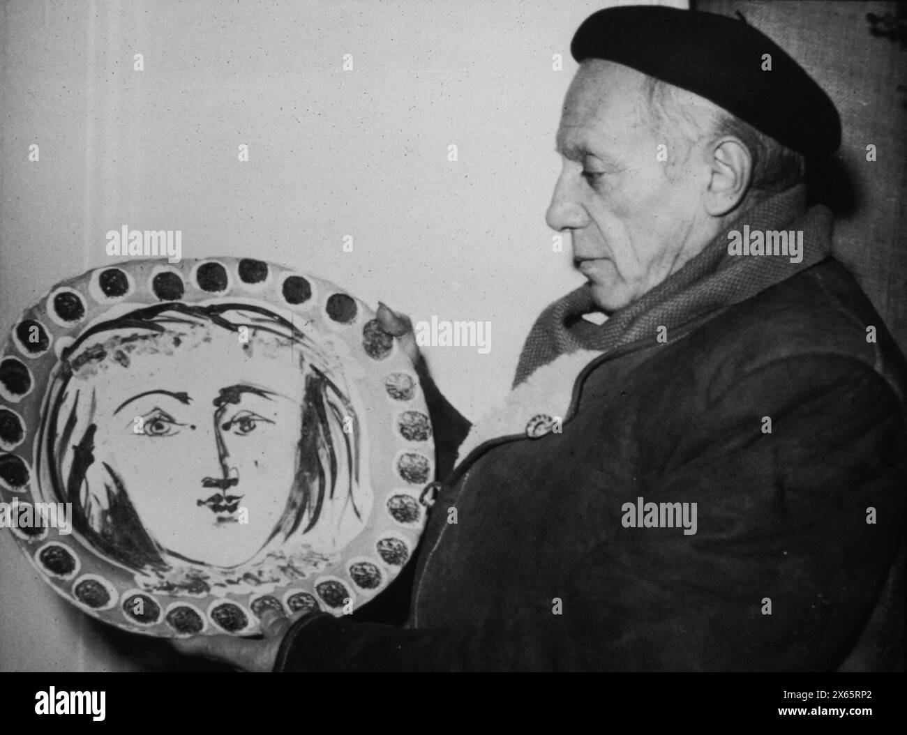 Spanish artist Pablo Picasso showing one of his pottery, 1940s Stock ...
