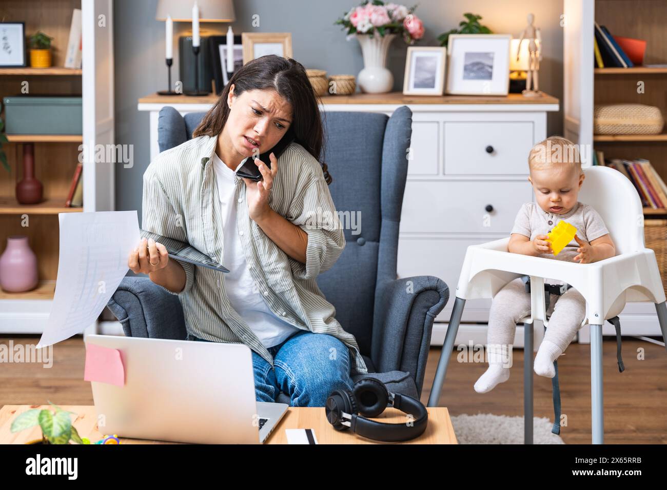 Multitasking mother. Young freelance business mom taking care of her ...