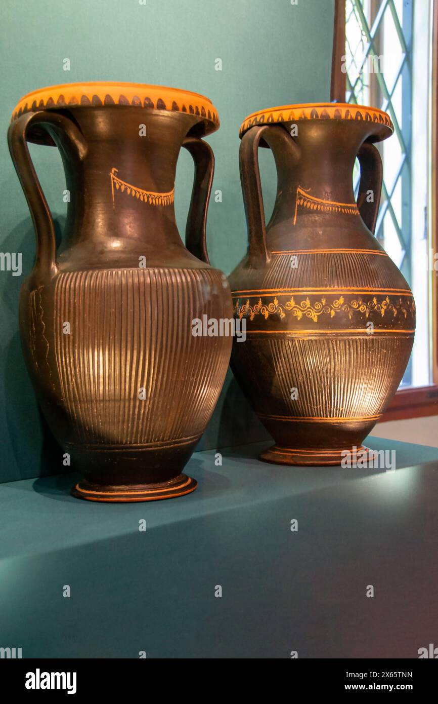 Antique ceramic decorative amphora on a white background. Clay jugs and ...