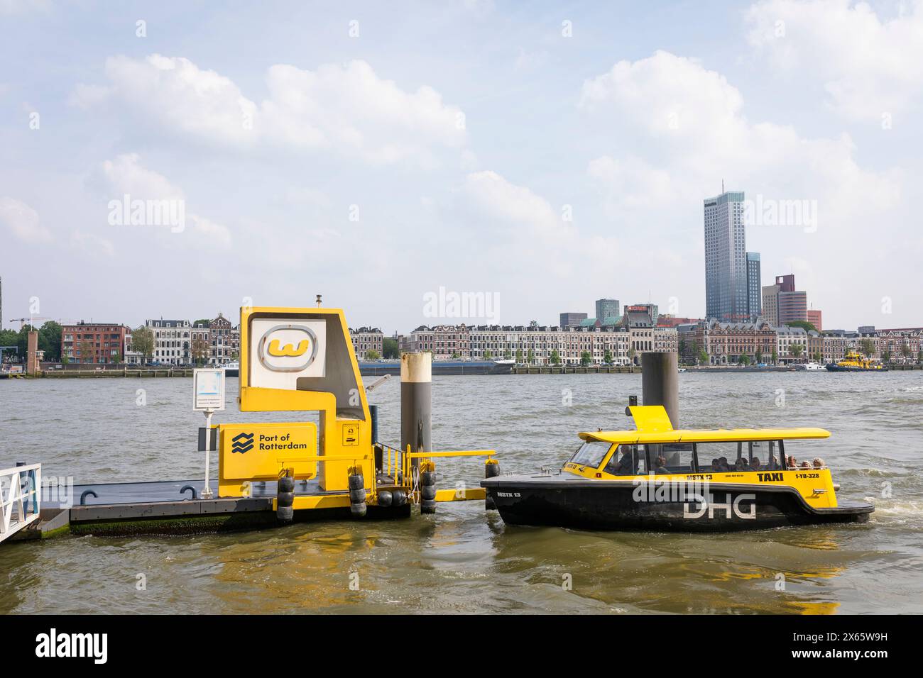 Water taxi arriviing at a landing stage in the harbor of Rotterdam ...