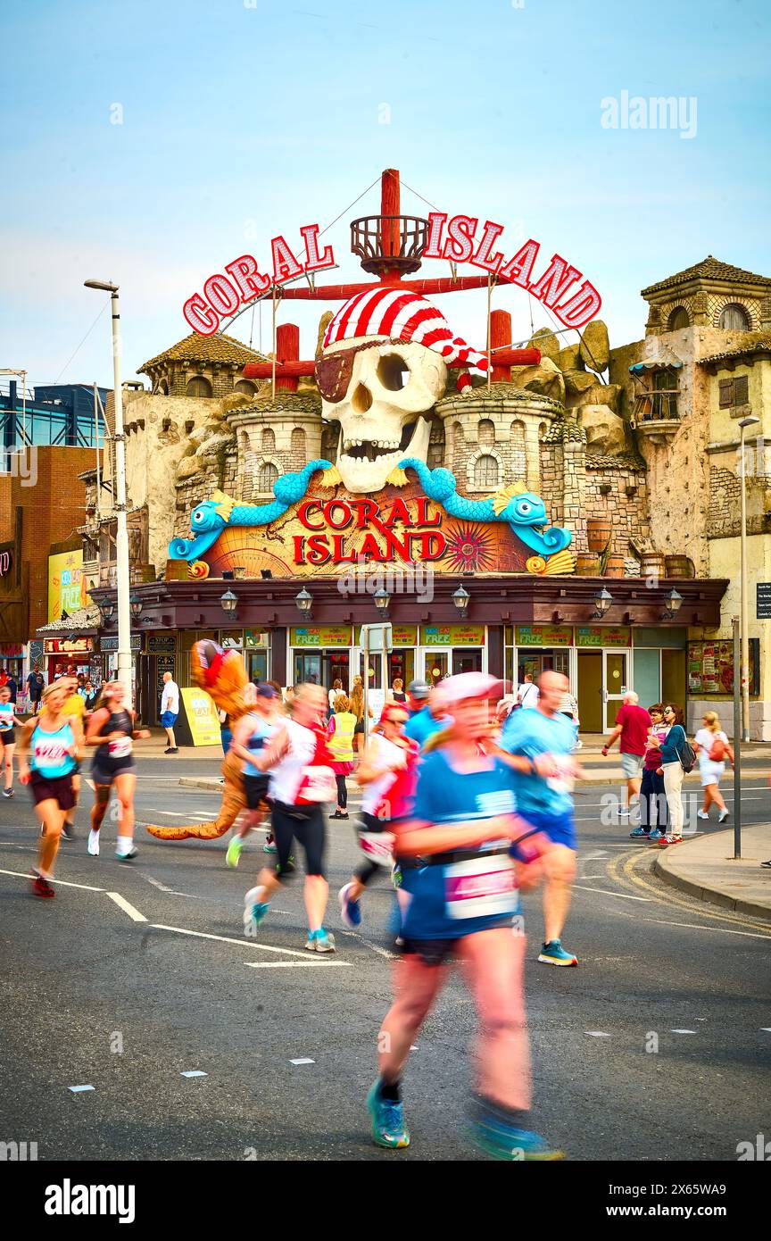 Motion blur of competitors in the Blackpool 10K funrun passing Coral ...
