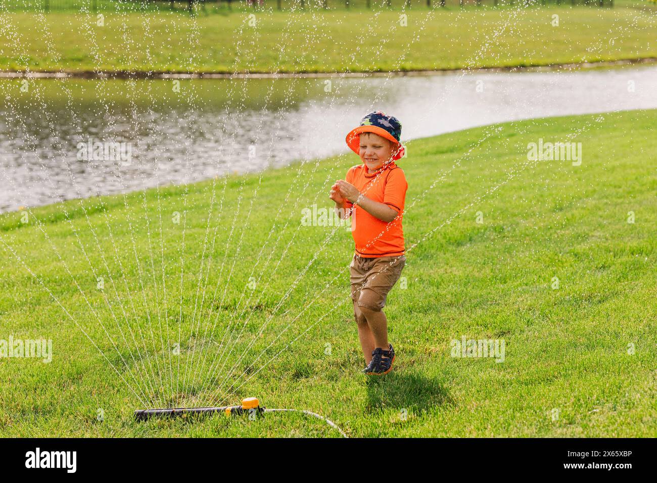 Outdoor summer day garden child wet hi-res stock photography and images - Alamy