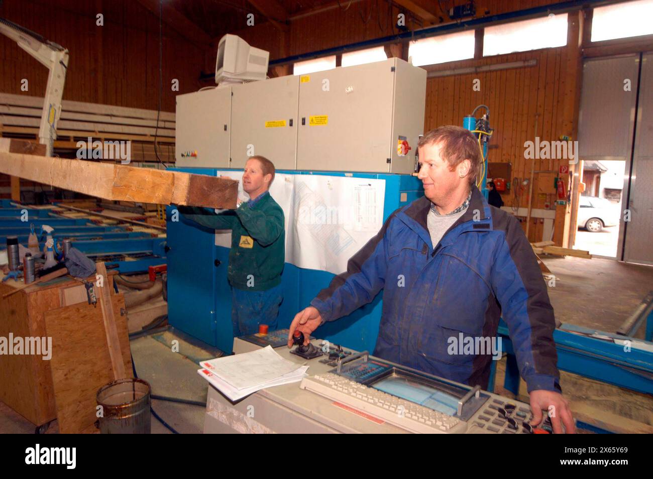 carpenter a craftsman who works with wood and processes it working in a ...
