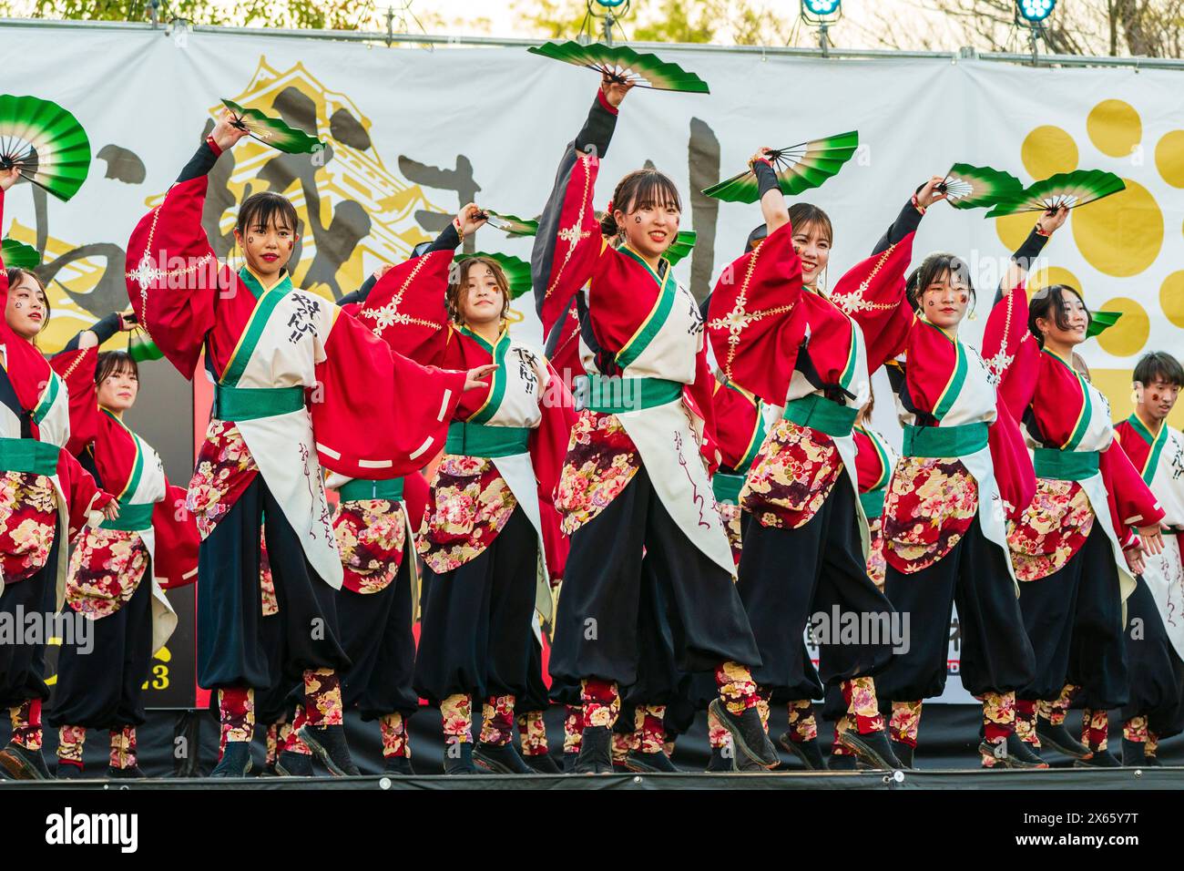 Japanese yosakoi dancers dancing on stage in long sleeve colorful ...