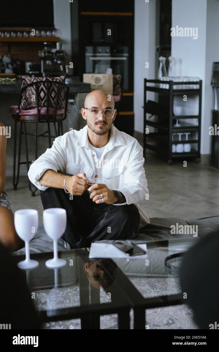 Young stylish bald man at a tea ceremony Stock Photo - Alamy
