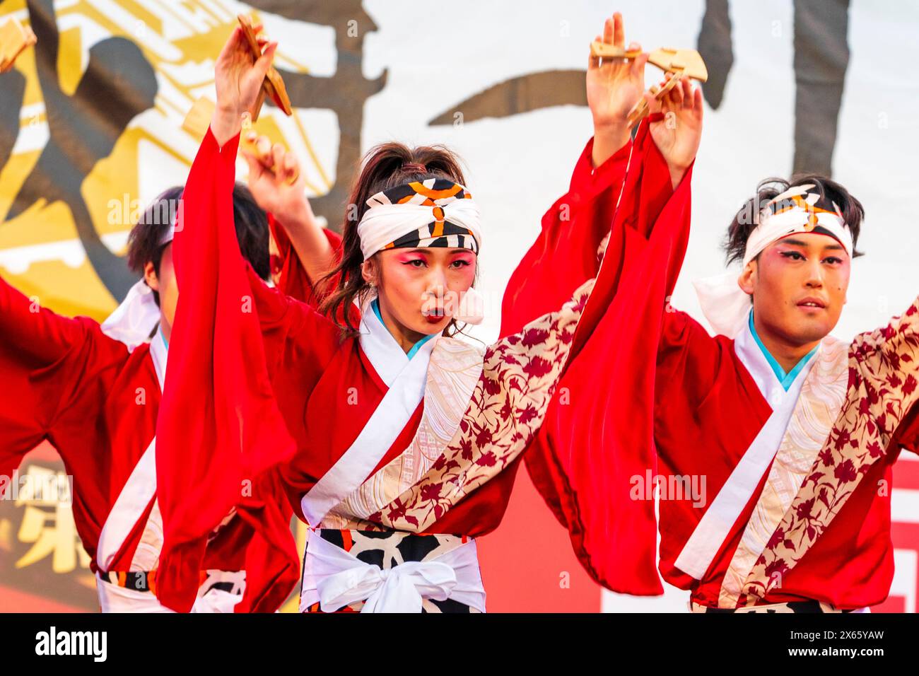 Japanese teenage woman Yosakoi dancer in red long sleeve yukata dancing ...