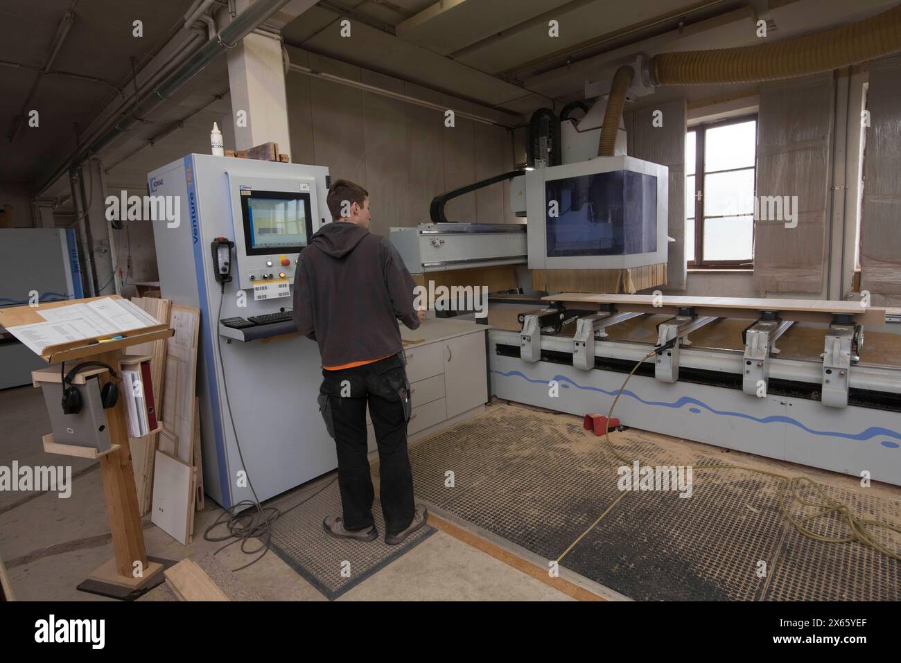 carpenter a craftsman who works with wood and processes it working in a ...