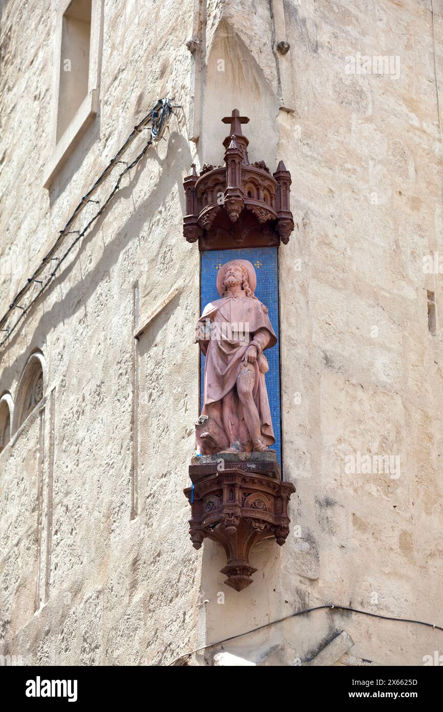 Statue of Saint Roch at the entrance to rue de la Vieille Aiguillerie ...