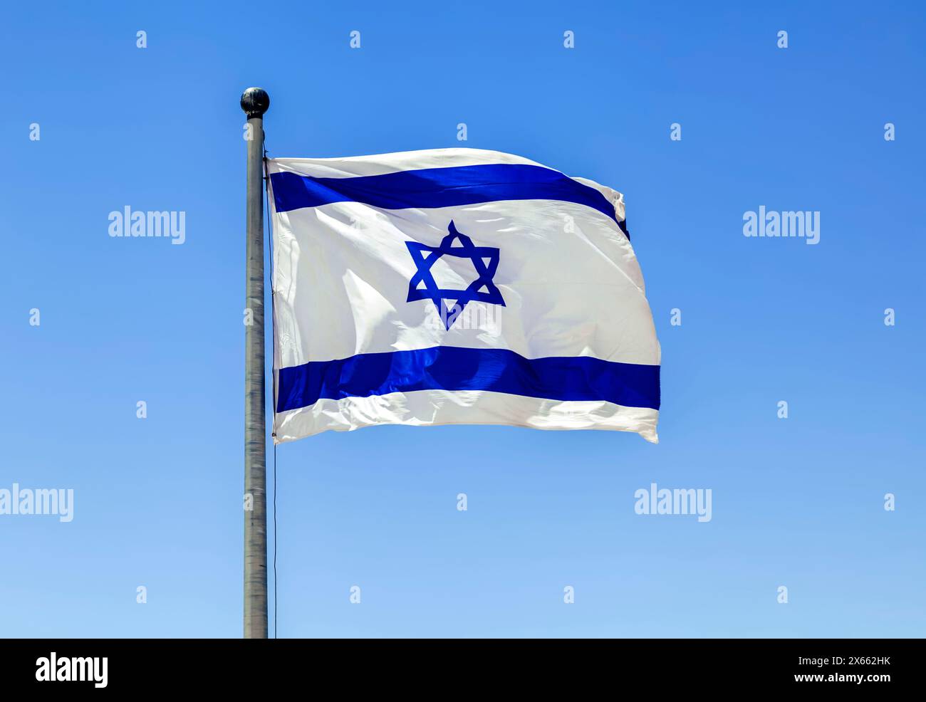 The Israeli flag waving in the bright sunlight Stock Photo - Alamy