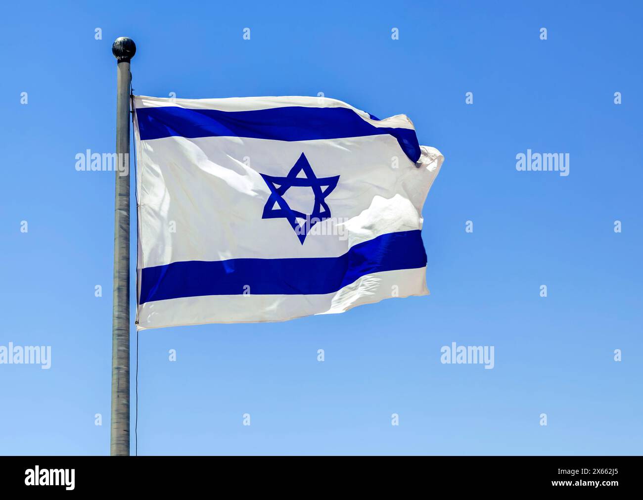 The Israeli flag waving in the bright sunlight Stock Photo - Alamy
