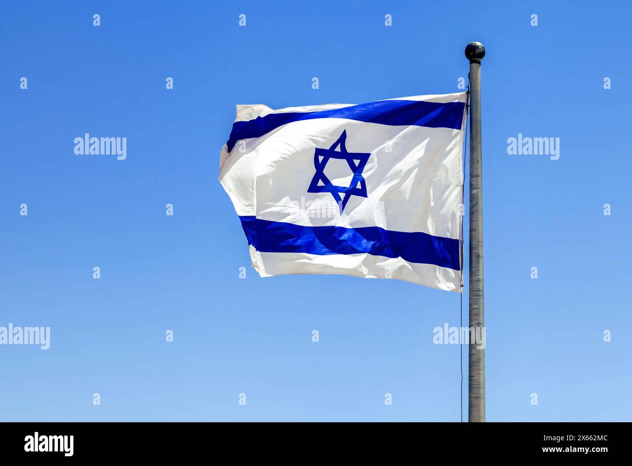 The Israeli flag waving in the bright sunlight Stock Photo - Alamy