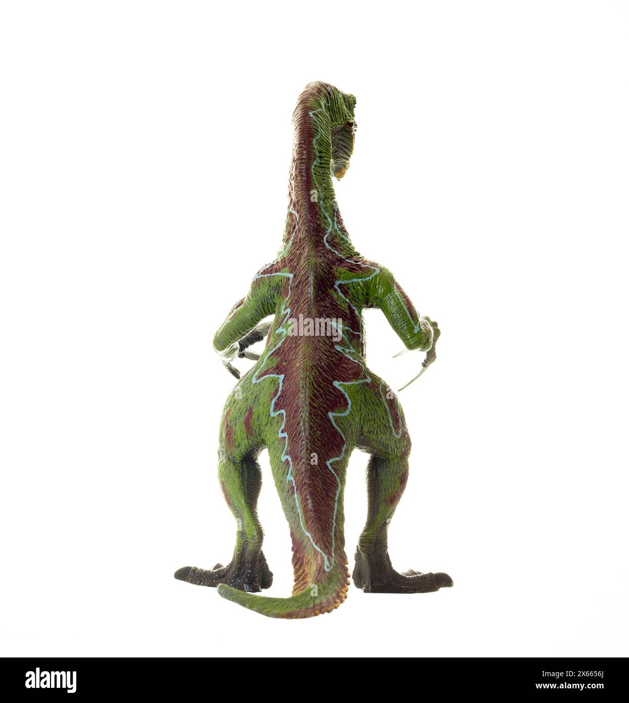 Toy dinosaur Therizinosaurus, a prehistoric creature, on transparent ...