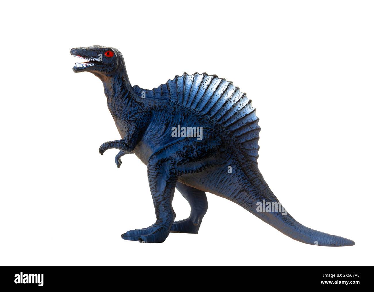 Detailed plastic toy model of a blue spinosaurus dinosaur against a ...