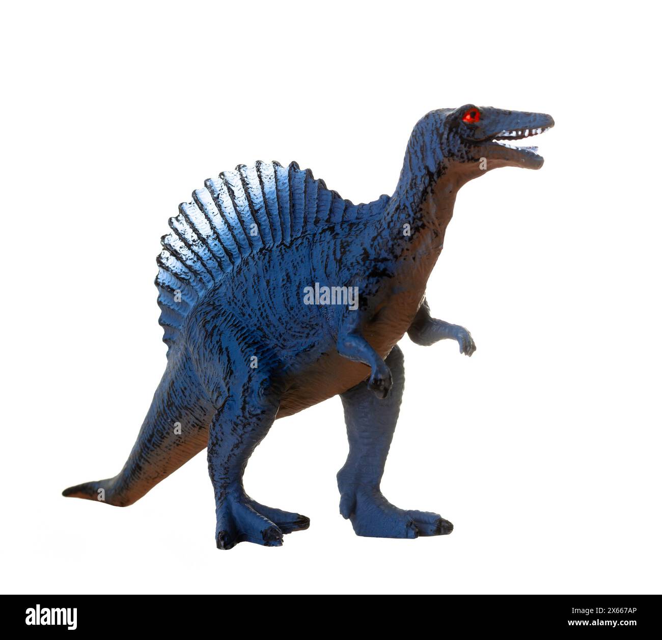 Detailed plastic toy model of a blue spinosaurus dinosaur against a ...