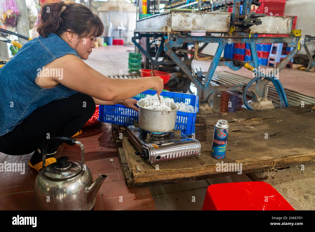 Woman reeling silk threads from hi-res stock photography and images - Alamy