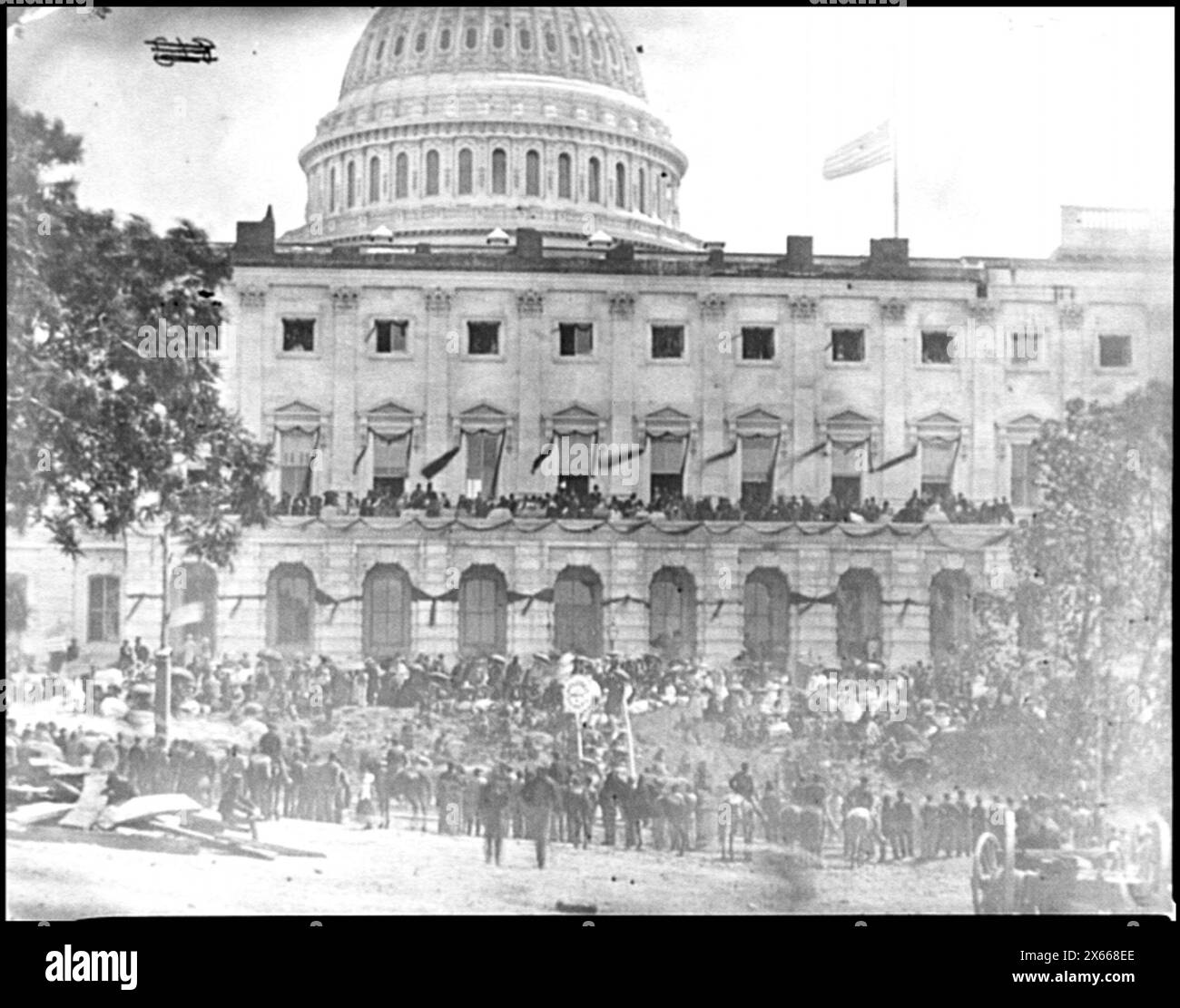 Washington, D.C. Spectators at side of the Capitol, which is hung with ...