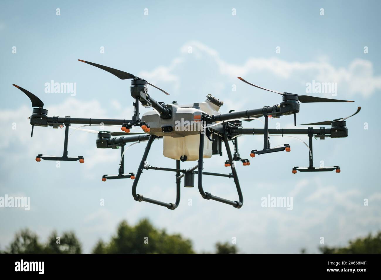 Close up of agricultural drone with spray nozzles and tank. Dron ...