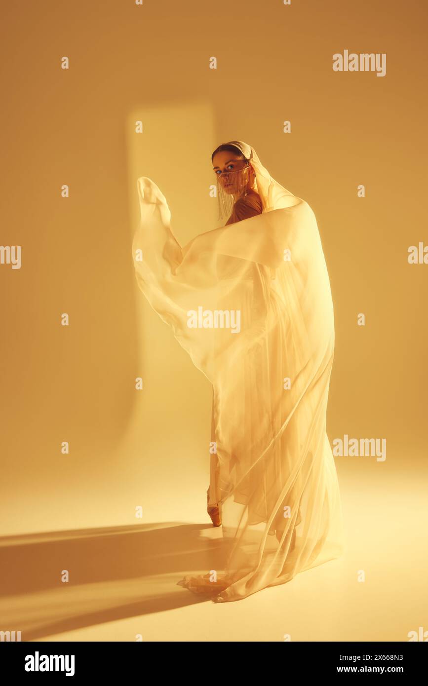 Ethereal beauty. Mystical scene of female ballet dancer with golden ...