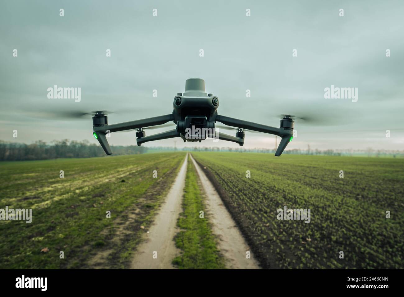 Aerial view of a drone moderning over farm fields, monitoring ...