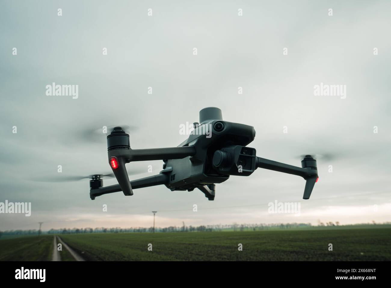 Aerial view of a drone moderning over farm fields, monitoring ...