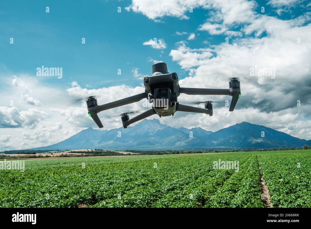 Aerial view of a drone moderning over farm fields, monitoring ...