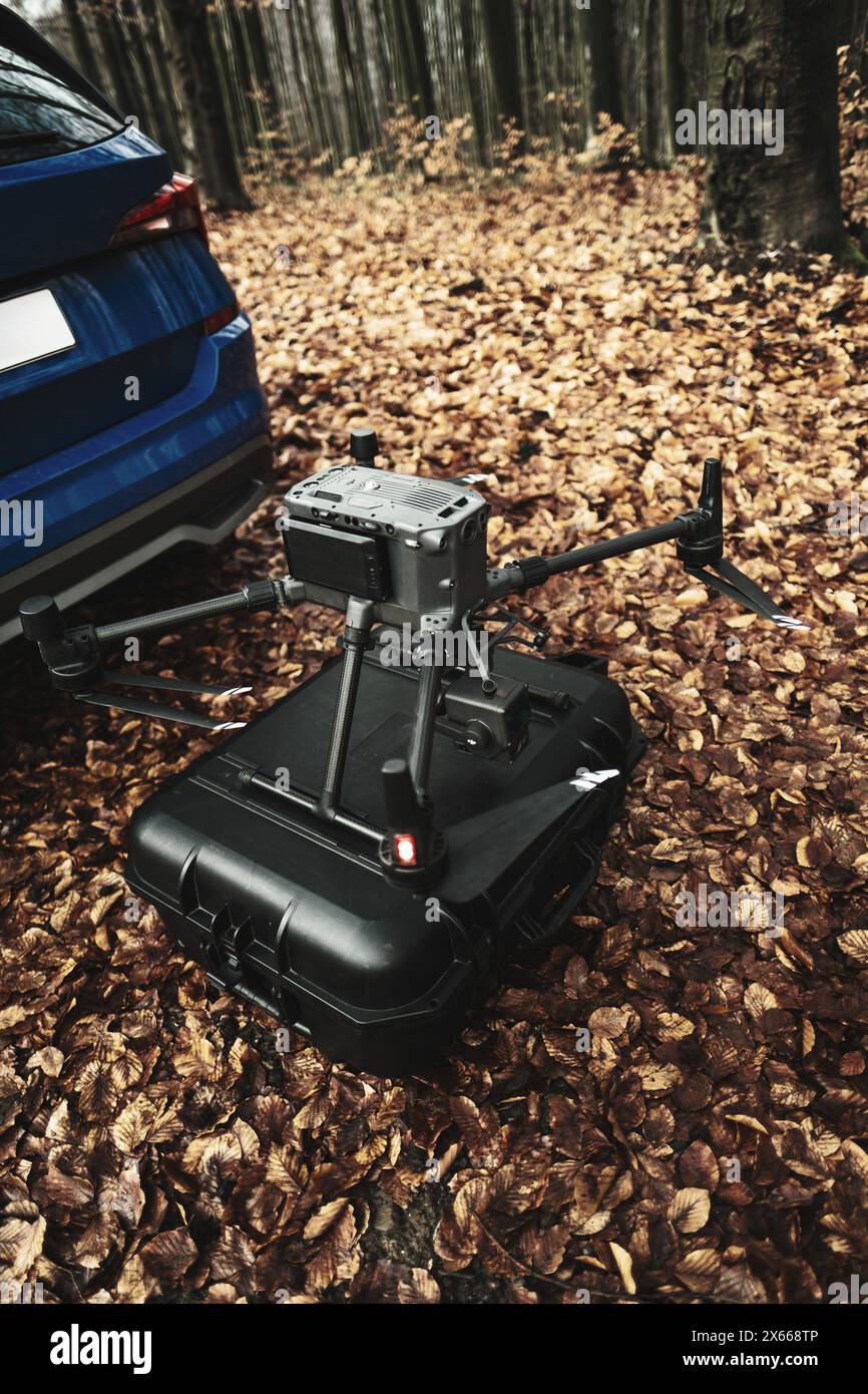 Aerial view of a drone moderning over forest, monitoring and analyzing ...