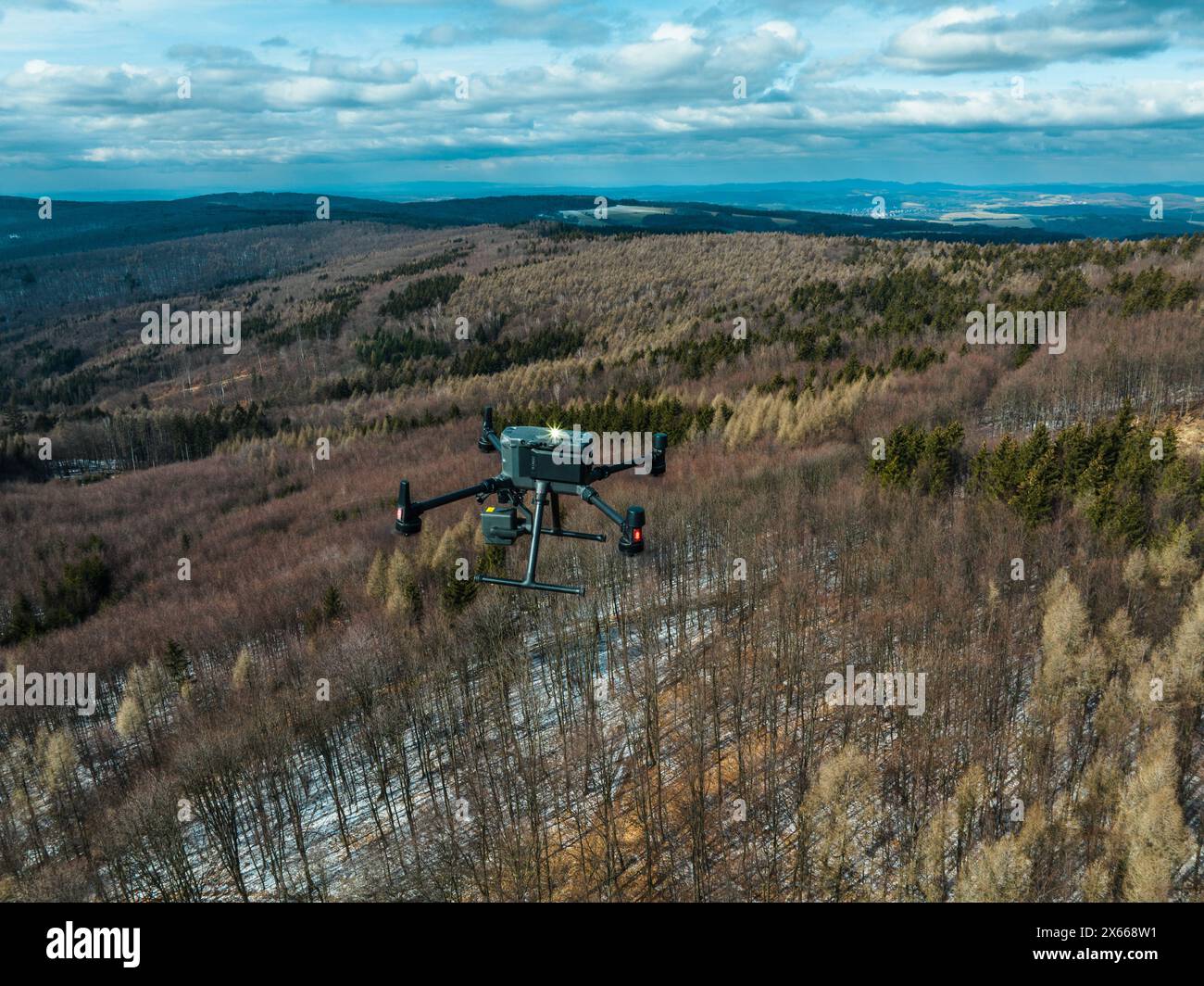 Aerial view of a drone moderning over forest, monitoring and analyzing ...