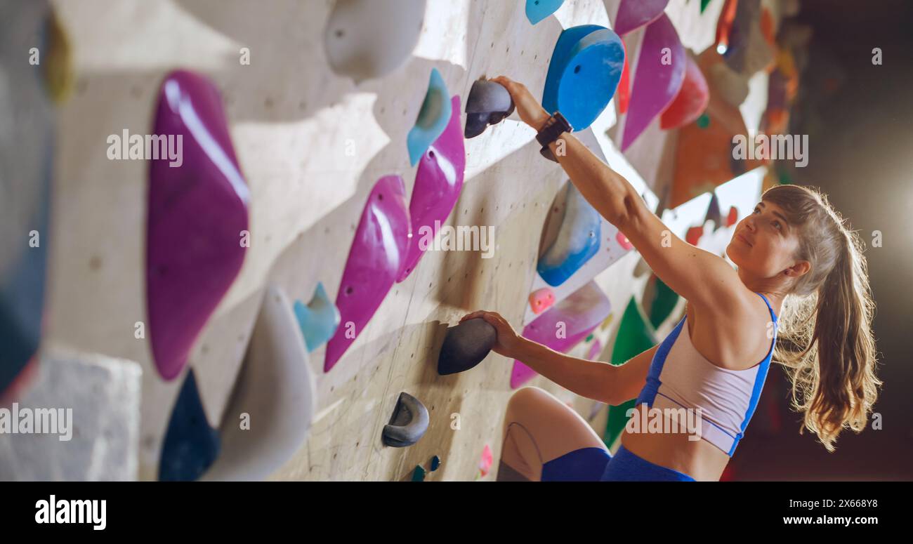 Athletic Female Rock Climber Practicing Solo Climbing on Bouldering ...