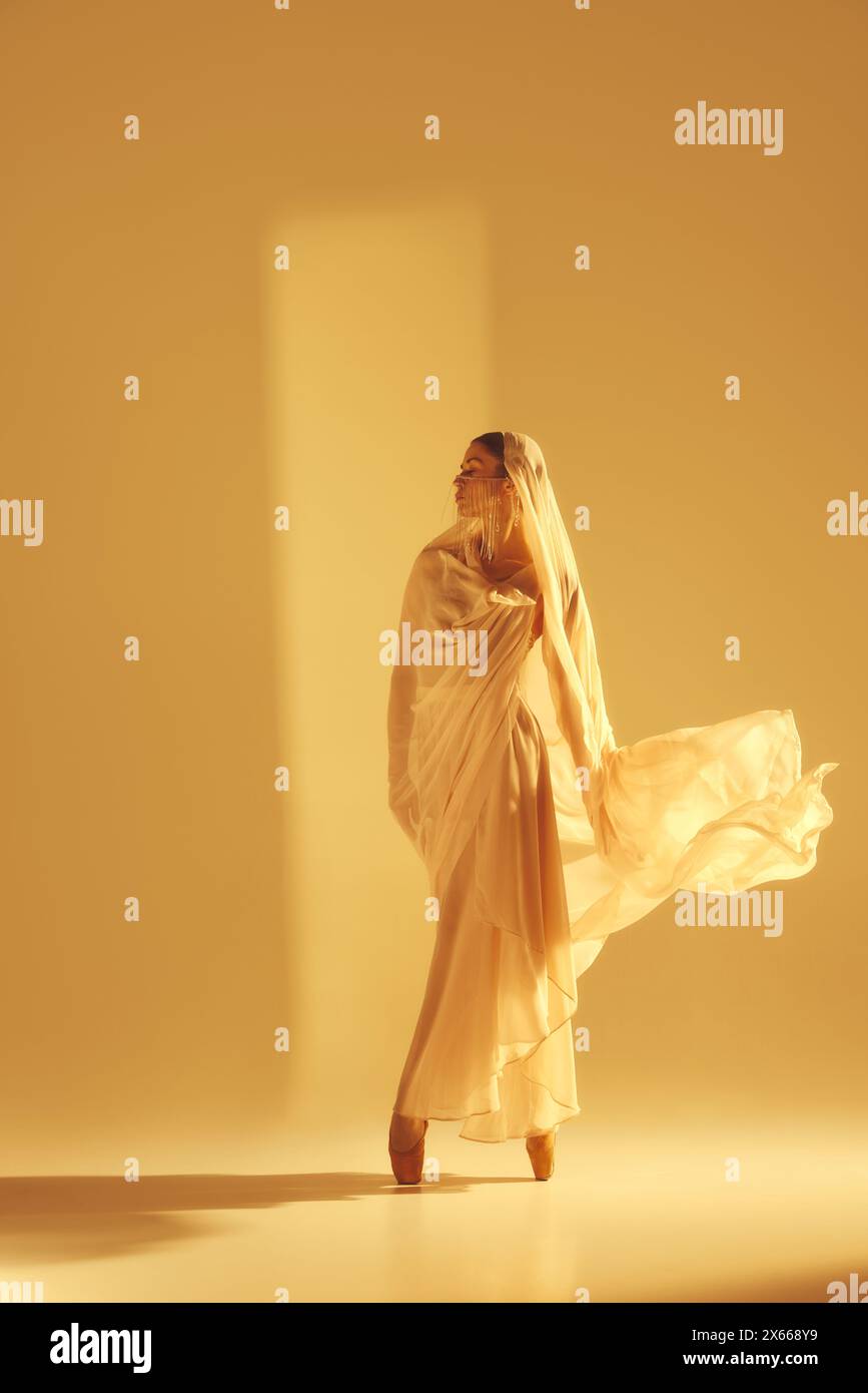 Ethereal beauty. Mystical scene of female ballet dancer with golden ...