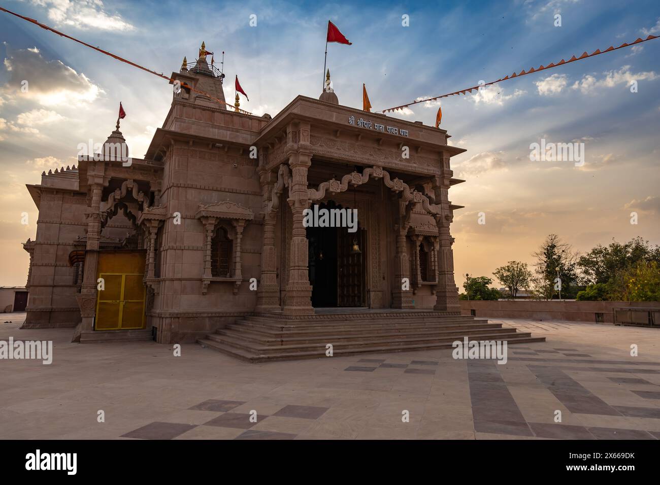 artistic hindu temple with dramatic sunset sky at evening from unique ...