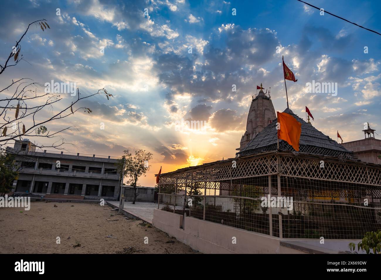 artistic hindu temple with dramatic sunset sky at evening from unique ...