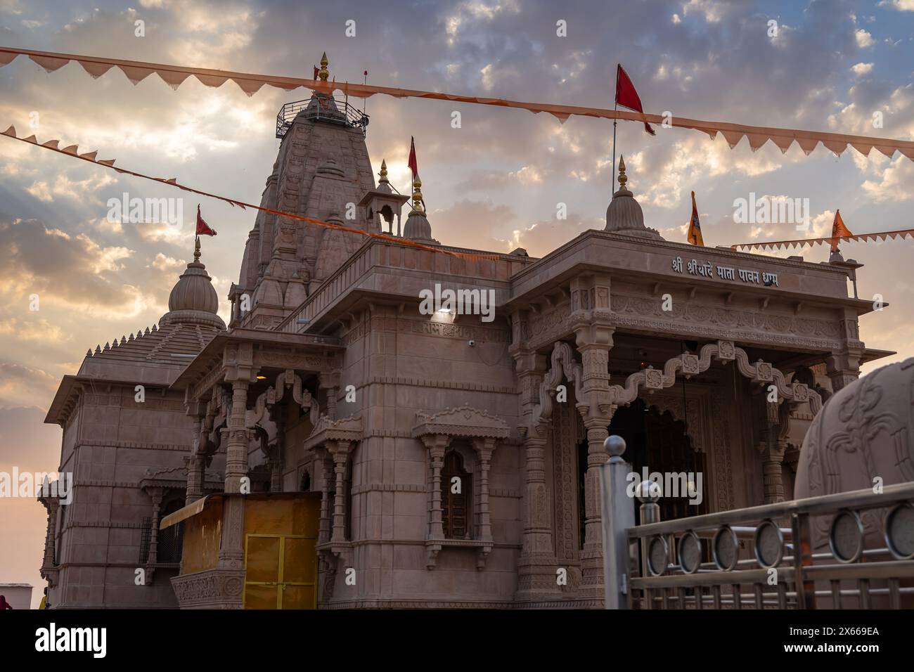 artistic hindu temple with dramatic sunset sky at evening from unique ...