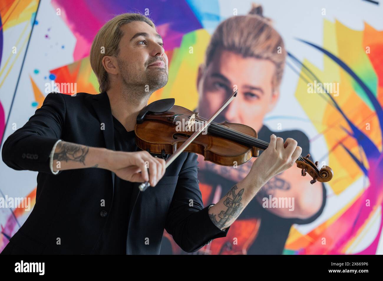 Cologne, Germany. 13th May, 2024. Violinist David Garrett stands at a ...