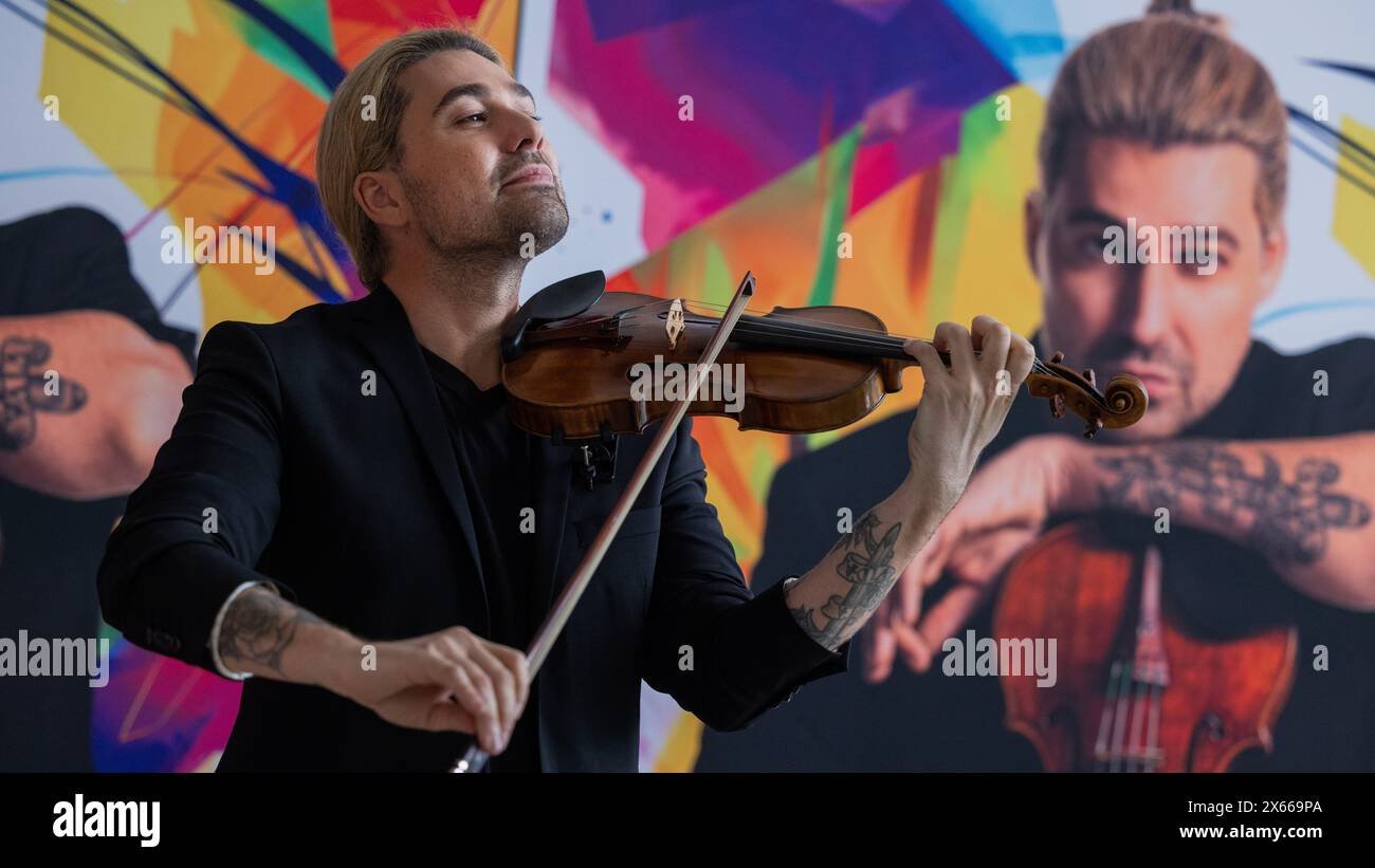 Cologne, Germany. 13th May, 2024. Violinist David Garrett stands at a ...