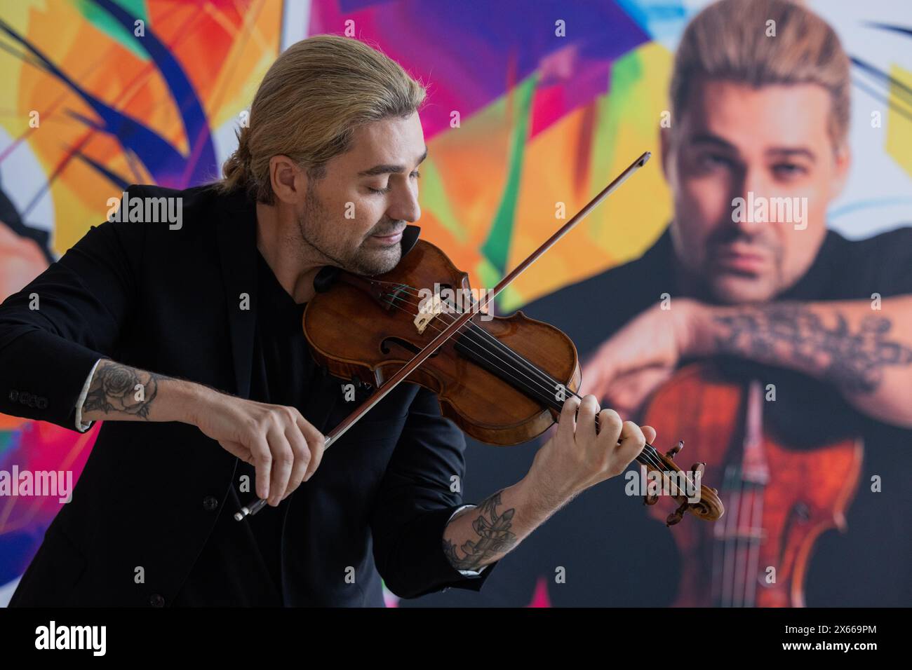 Cologne, Germany. 13th May, 2024. Violinist David Garrett stands at a ...
