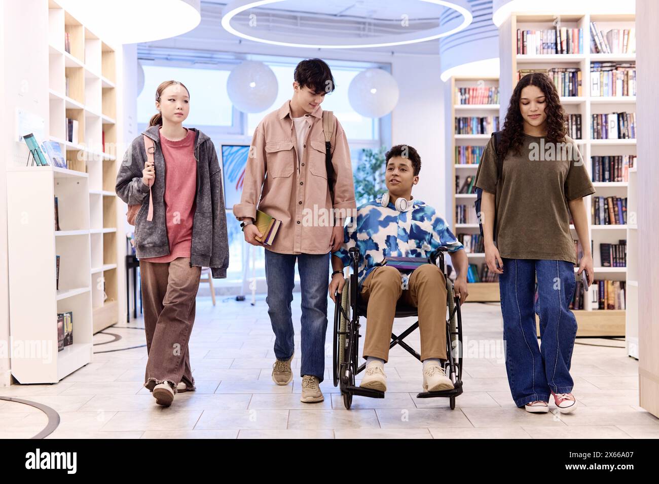 Full length portrait of inclusive group of teenagers walking towards ...