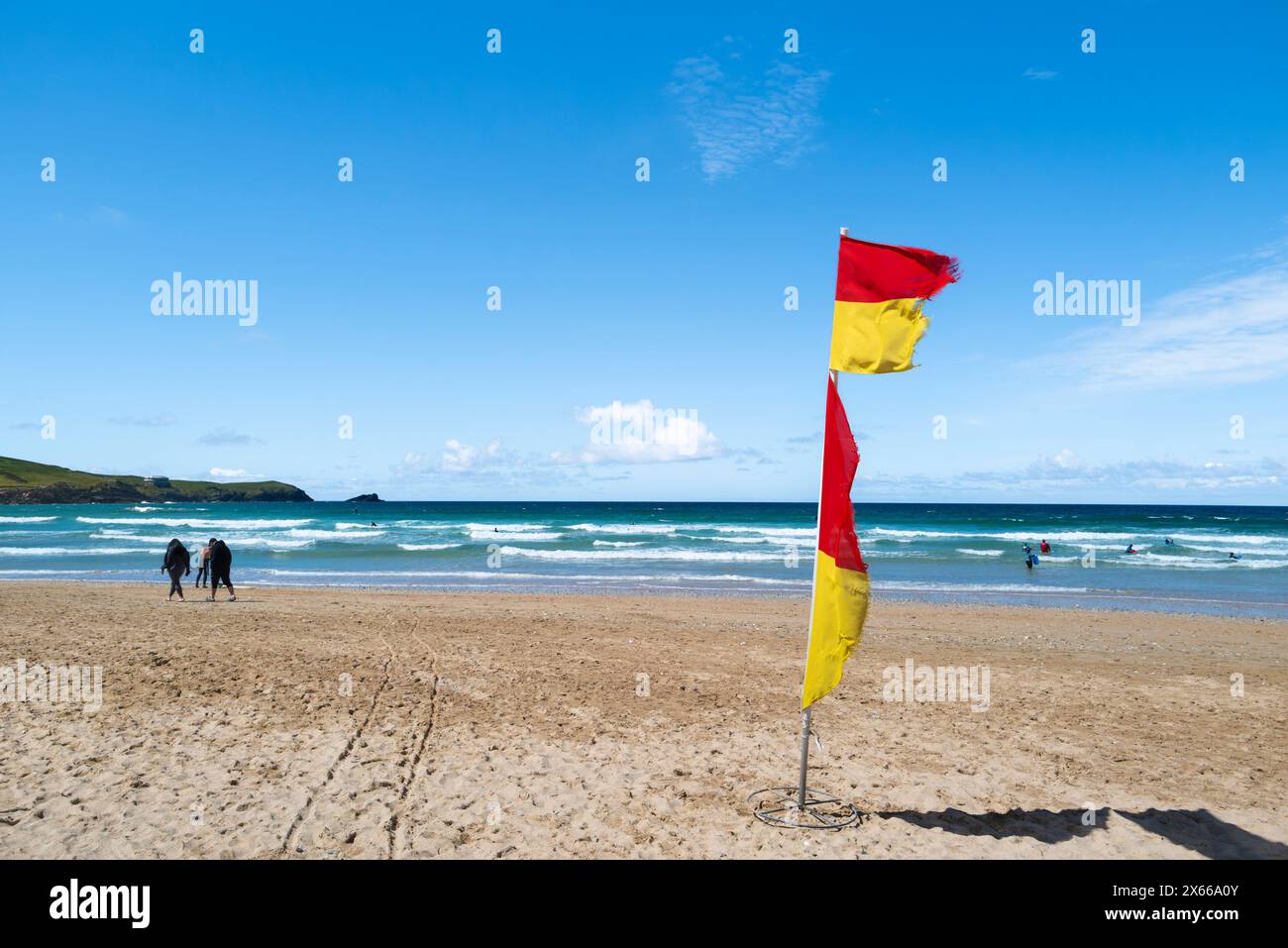 A red and yellow safety flag indicating the swim zone area on Fistral ...