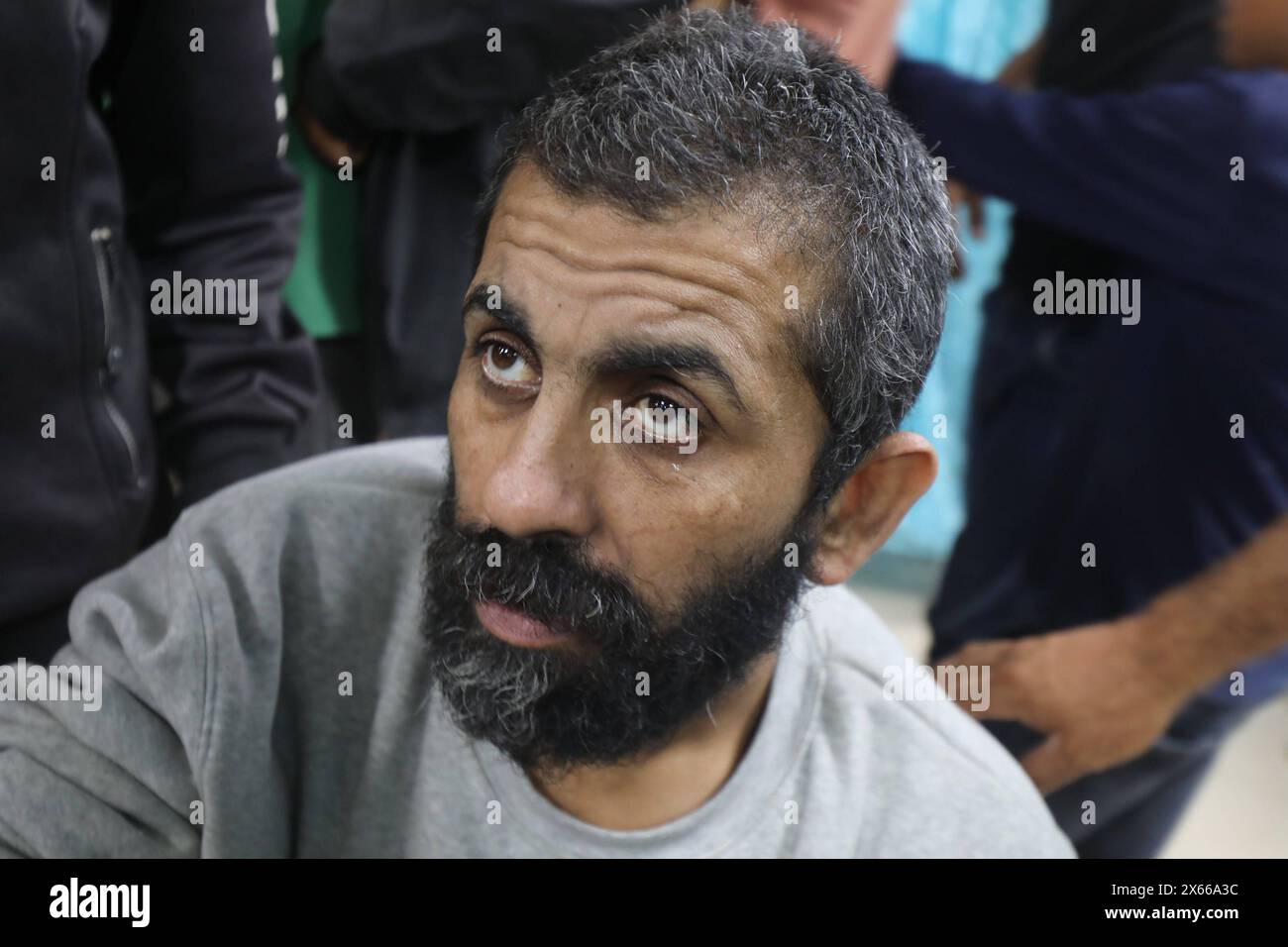 Palestinian men who had been detained by Israeli forces receiving ...