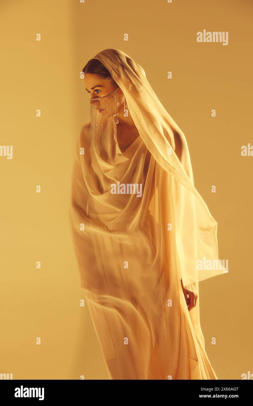 Woman face covered flowing fabric hi-res stock photography and images ...