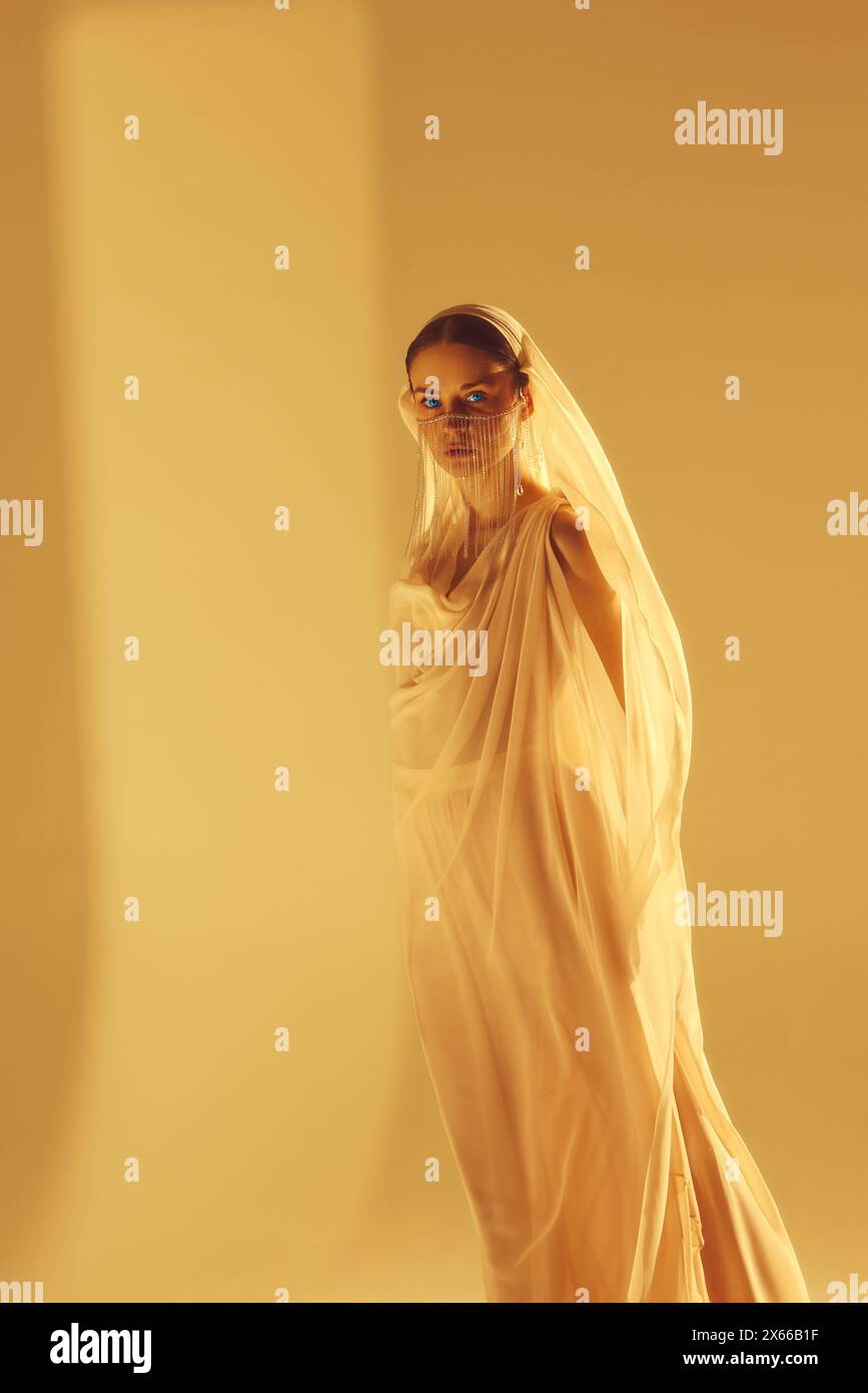 Woman face covered flowing fabric hi-res stock photography and images ...