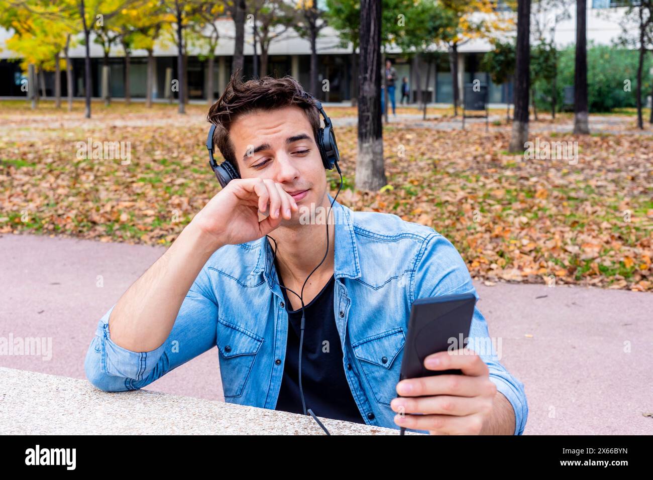 Leaning on a bench hi-res stock photography and images - Alamy