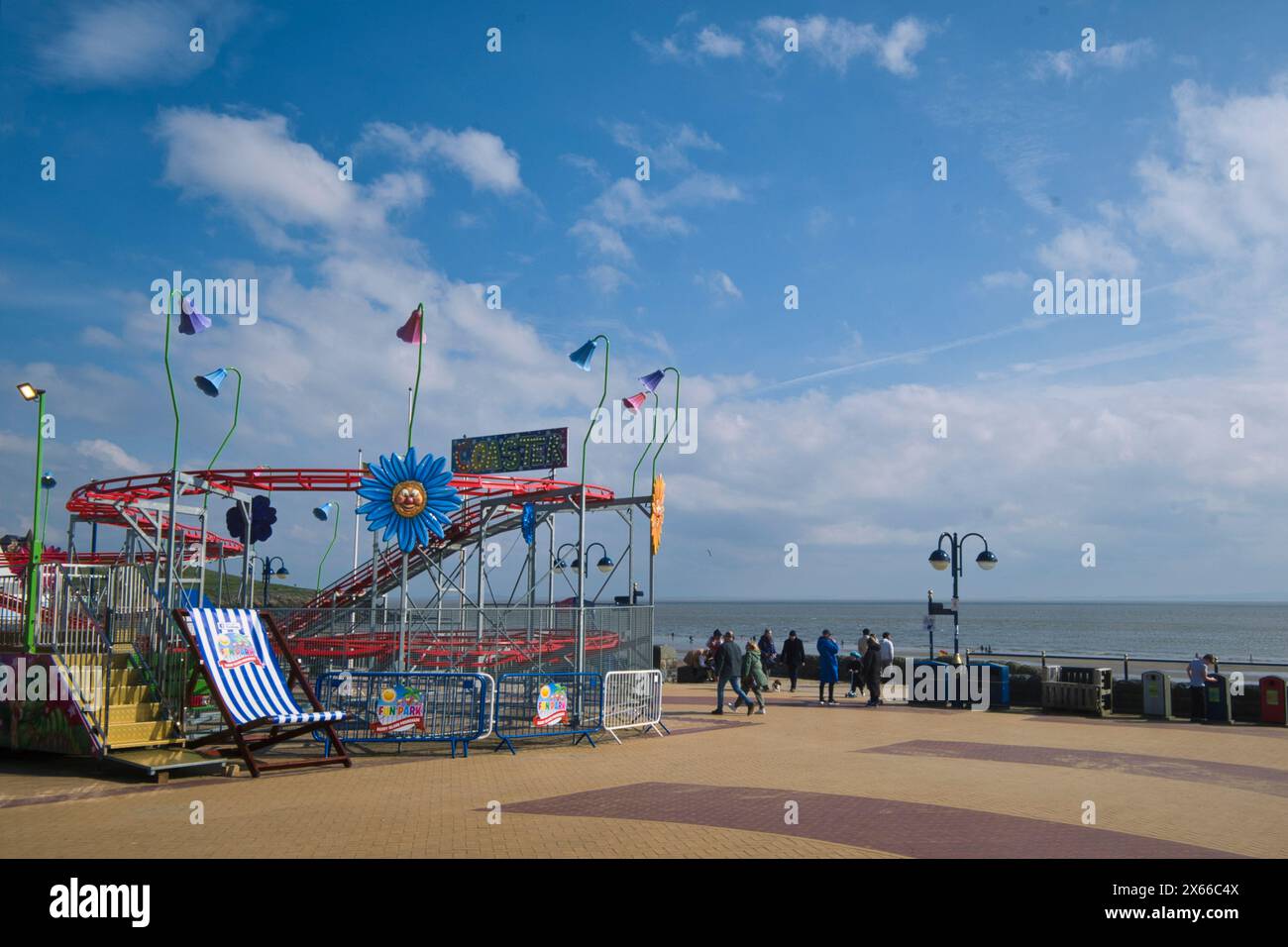Promenade on Whitmore Bay beach on Barry Island in Wales in early ...